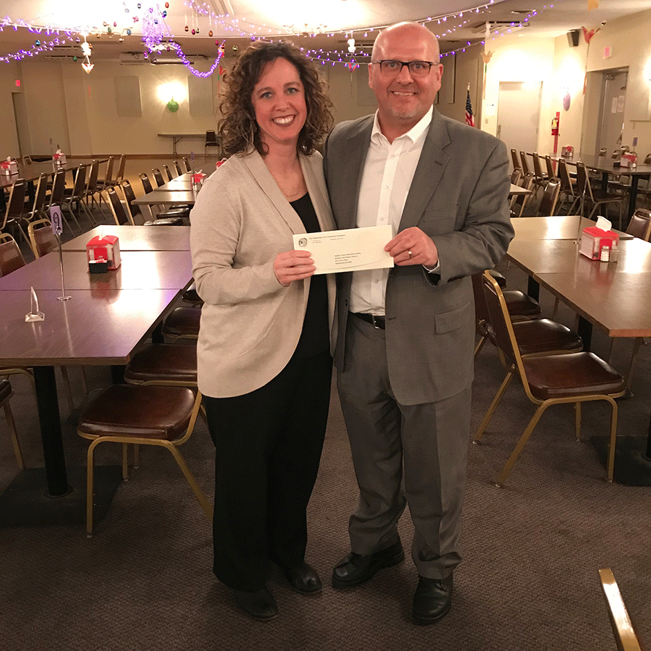 Board member Keith Horner, presents a Foundation grant check to Beth ...